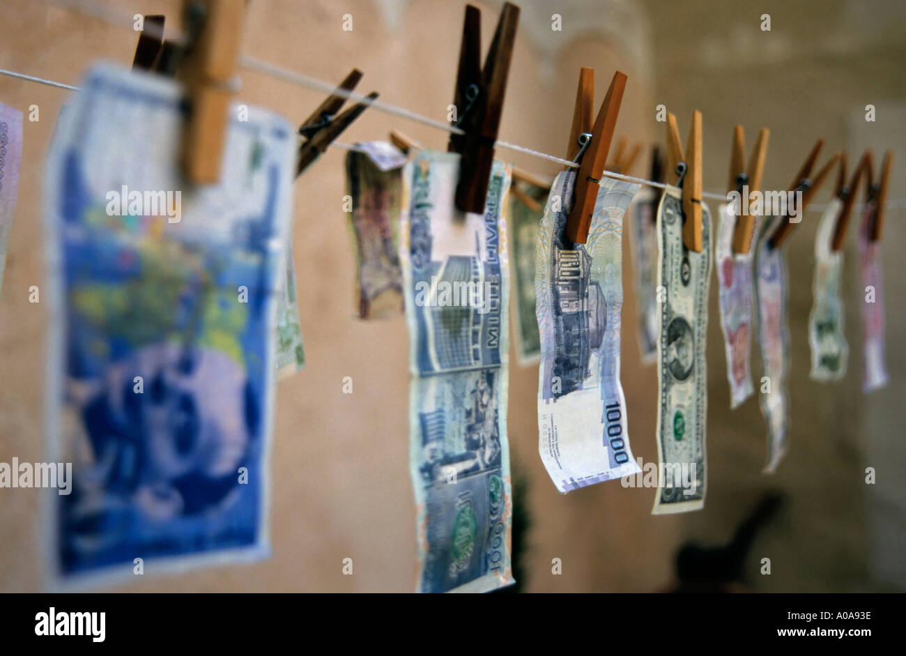 International banknotes drying on a washing line Stock Photo - Alamy