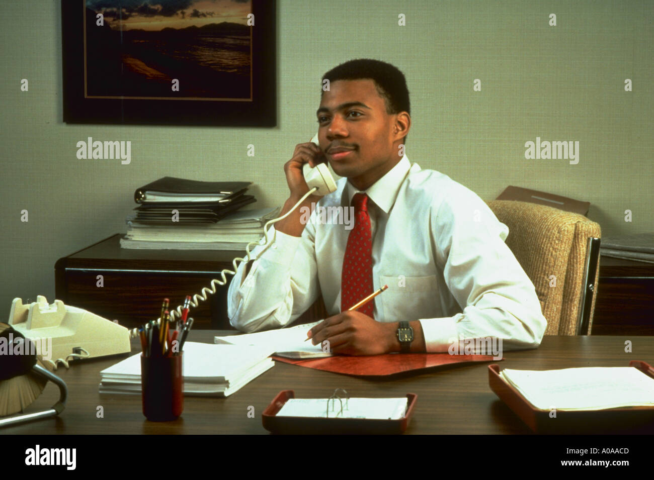 Jessie Miles talking on telephone in Maryland office Stock Photo - Alamy