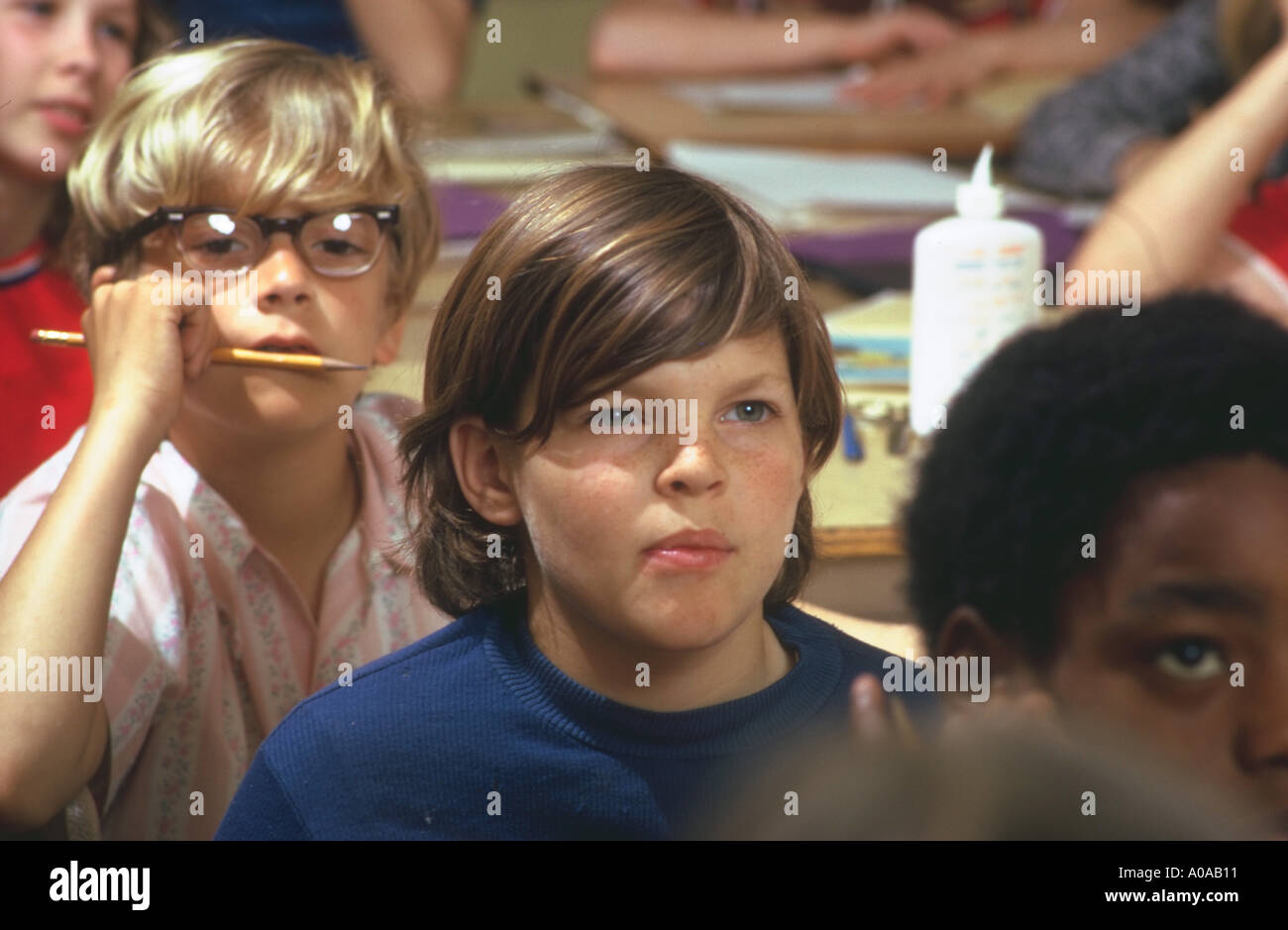 Fifth grade students listen in class Stock Photo - Alamy