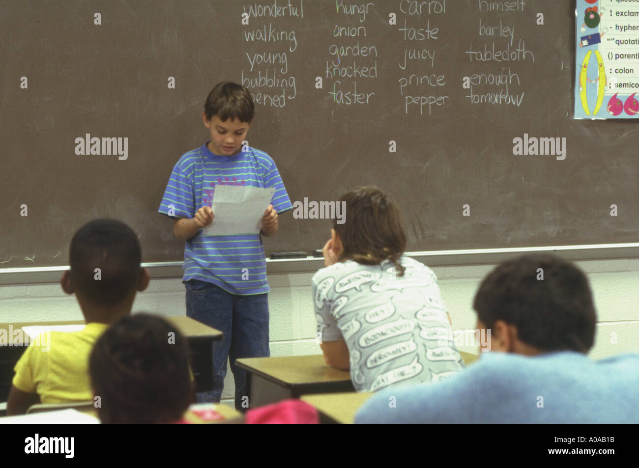 Fourth grade students read reports aloud to class model released Stock ...