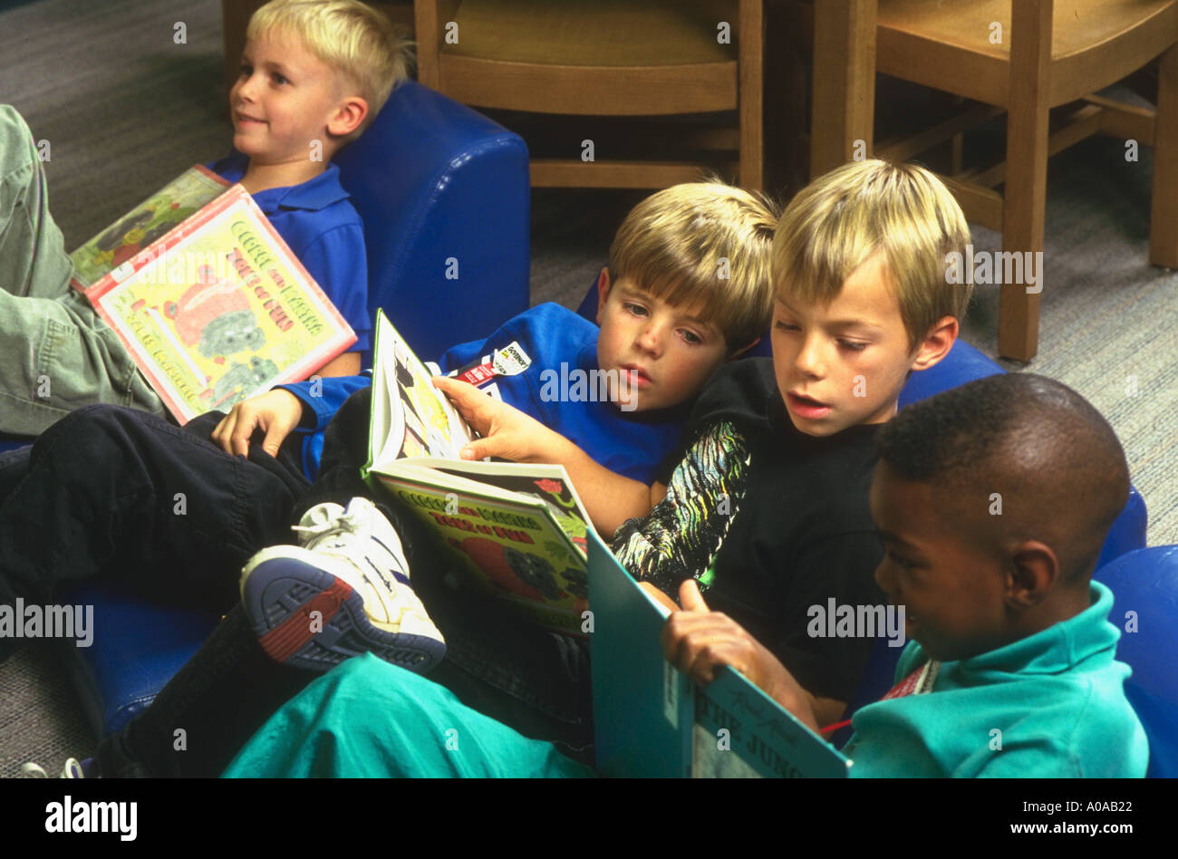 First grade students on library floor reading books model released ...