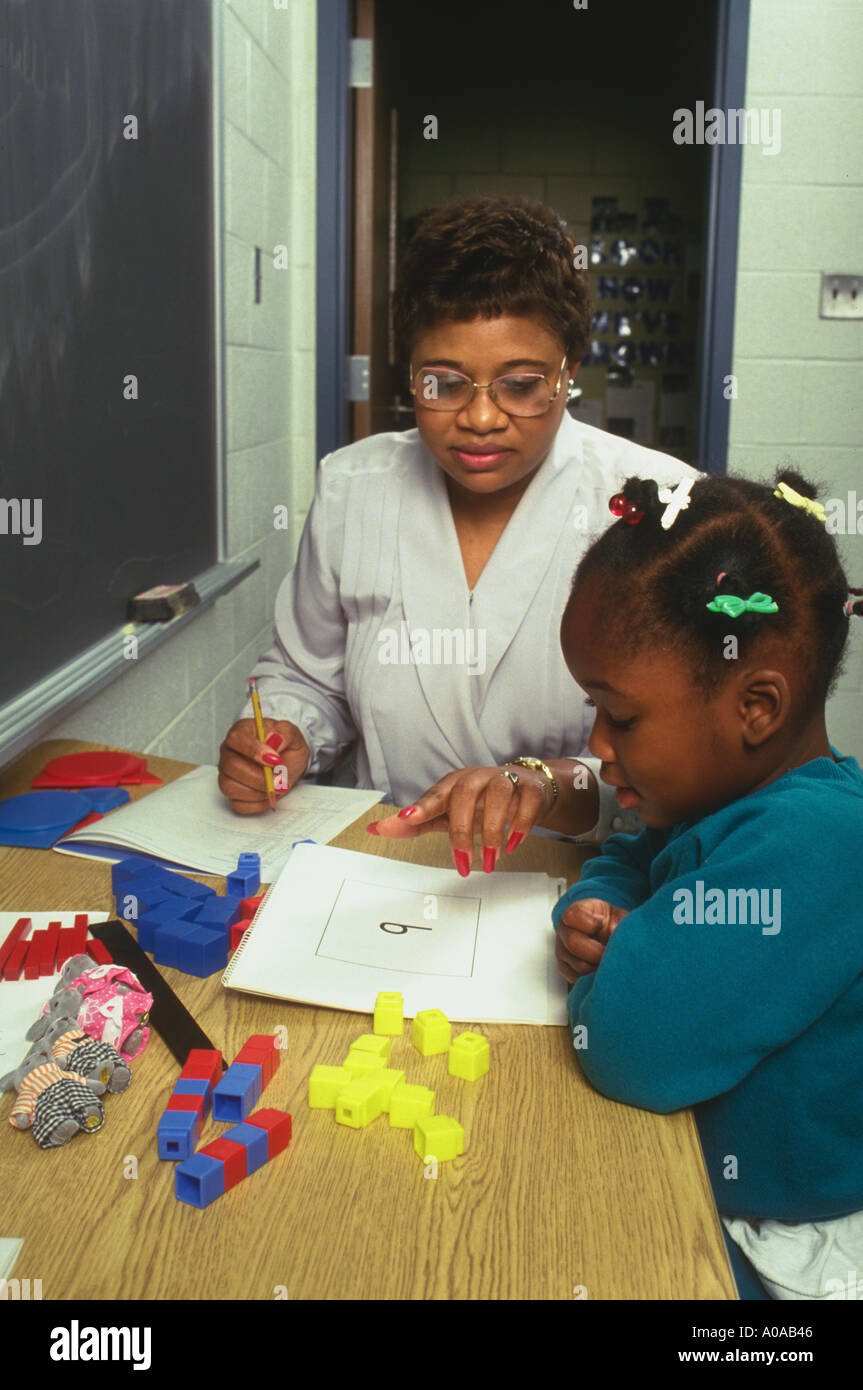 Preschool child being tested by school counselor model released Stock ...