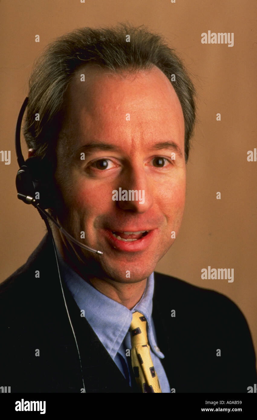 Telephone operator man with headset Stock Photo - Alamy