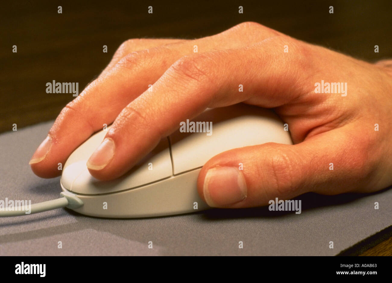 Hand on mouse Stock Photo - Alamy