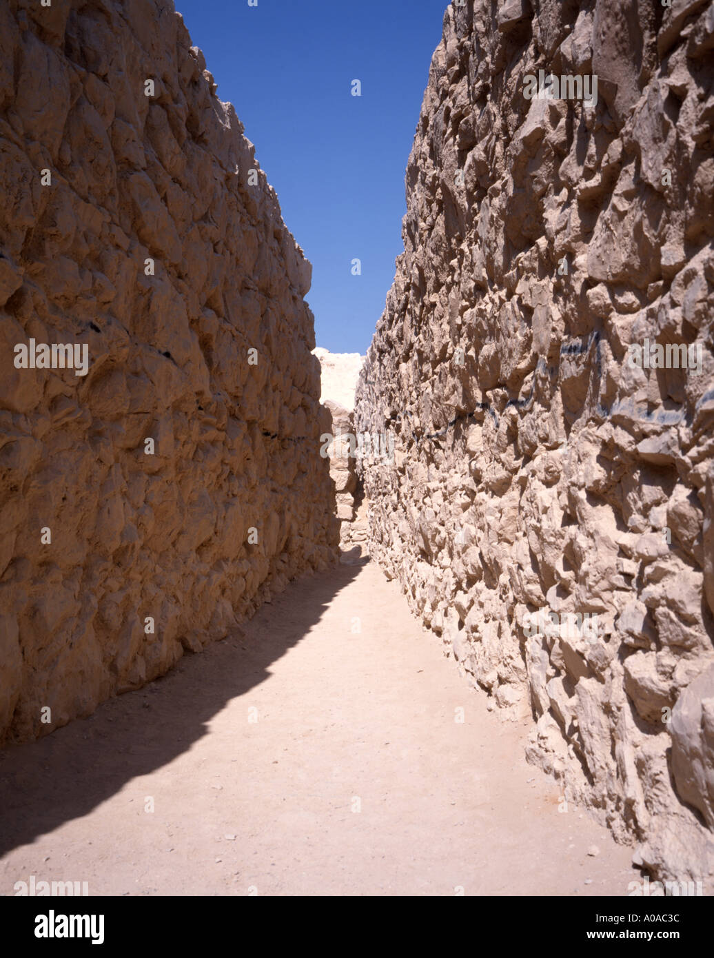 A narrow passage between two walls, Masada Israel Stock Photo - Alamy