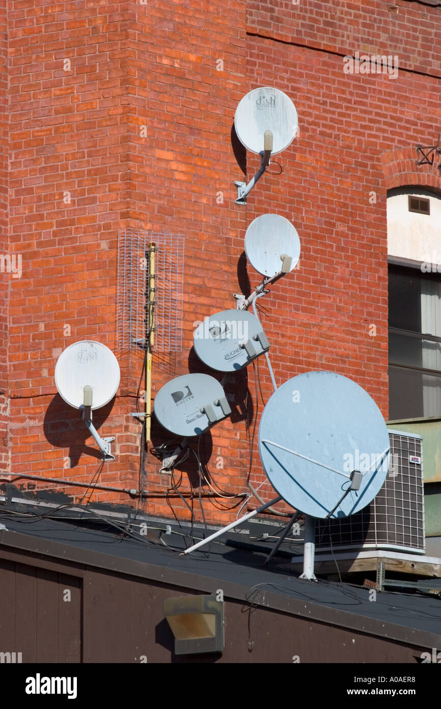 Satellite dishes on a building rooftop Stock Photo - Alamy