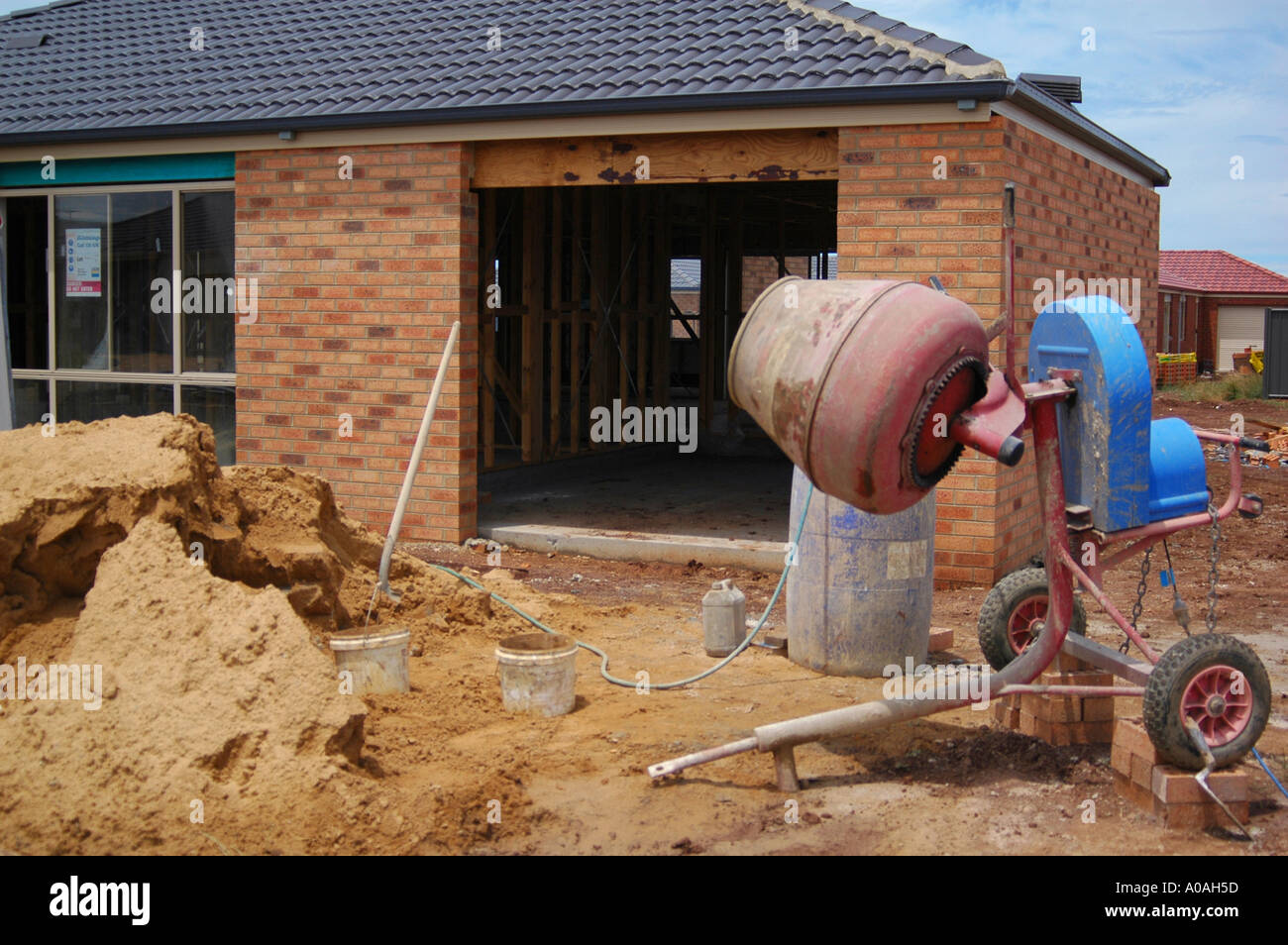House building with a concrete mixer in front yard, Melbourne, Victoria ...