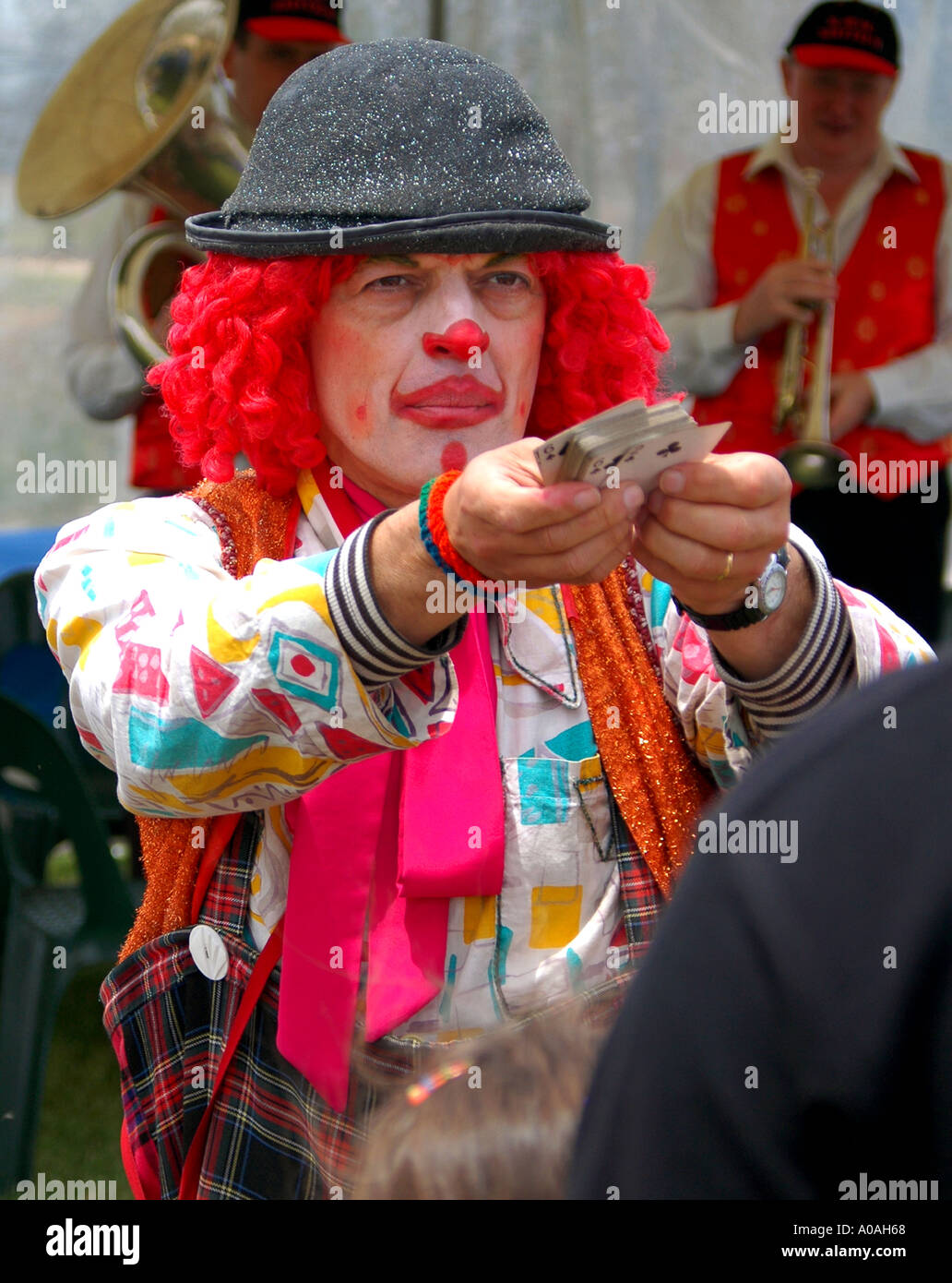A Clown doing a card trick, Melbourne, Victoria, Australia Stock Photo ...