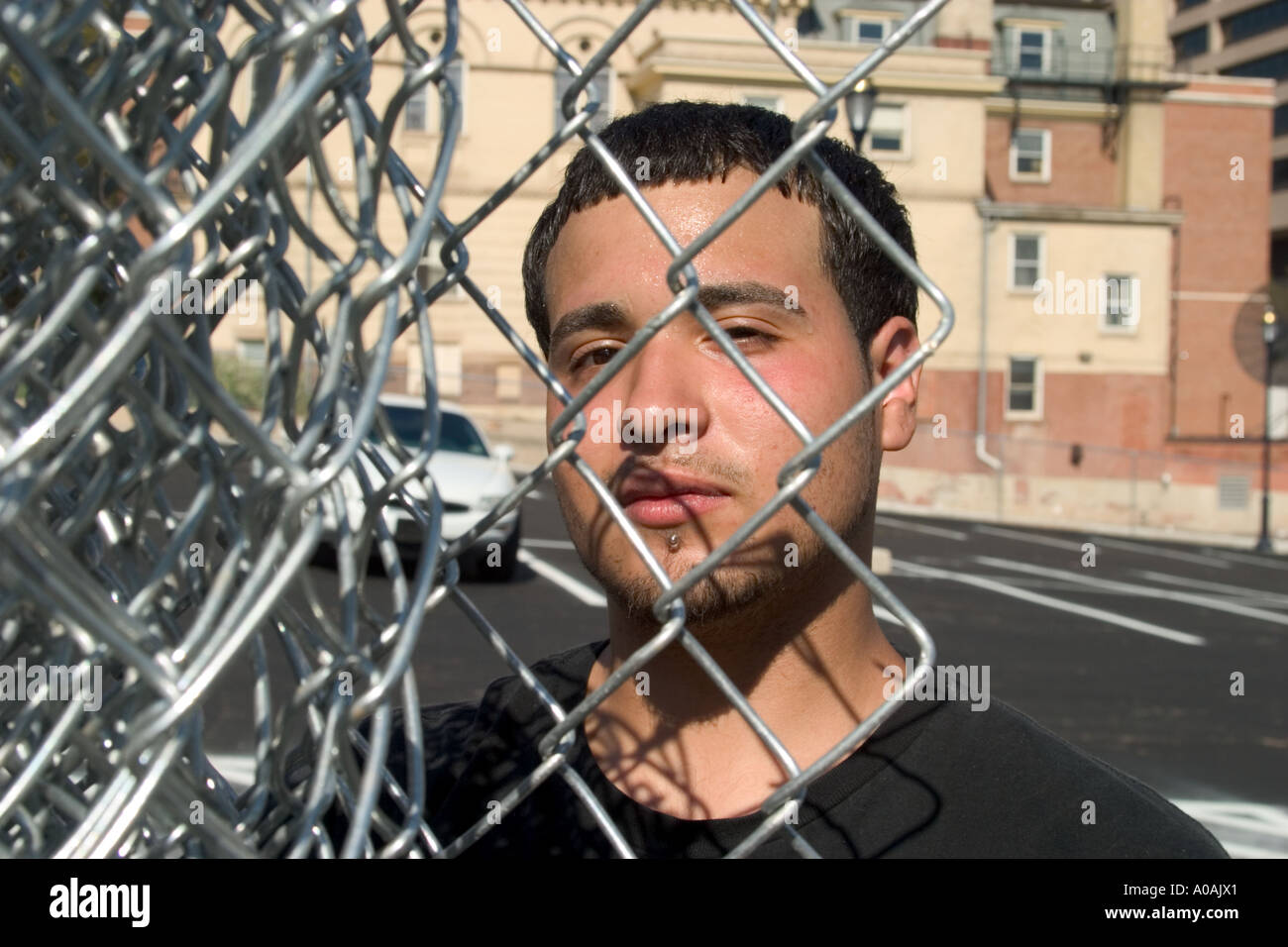 Teenage Spanish boy taking a break from working on the construction of ...
