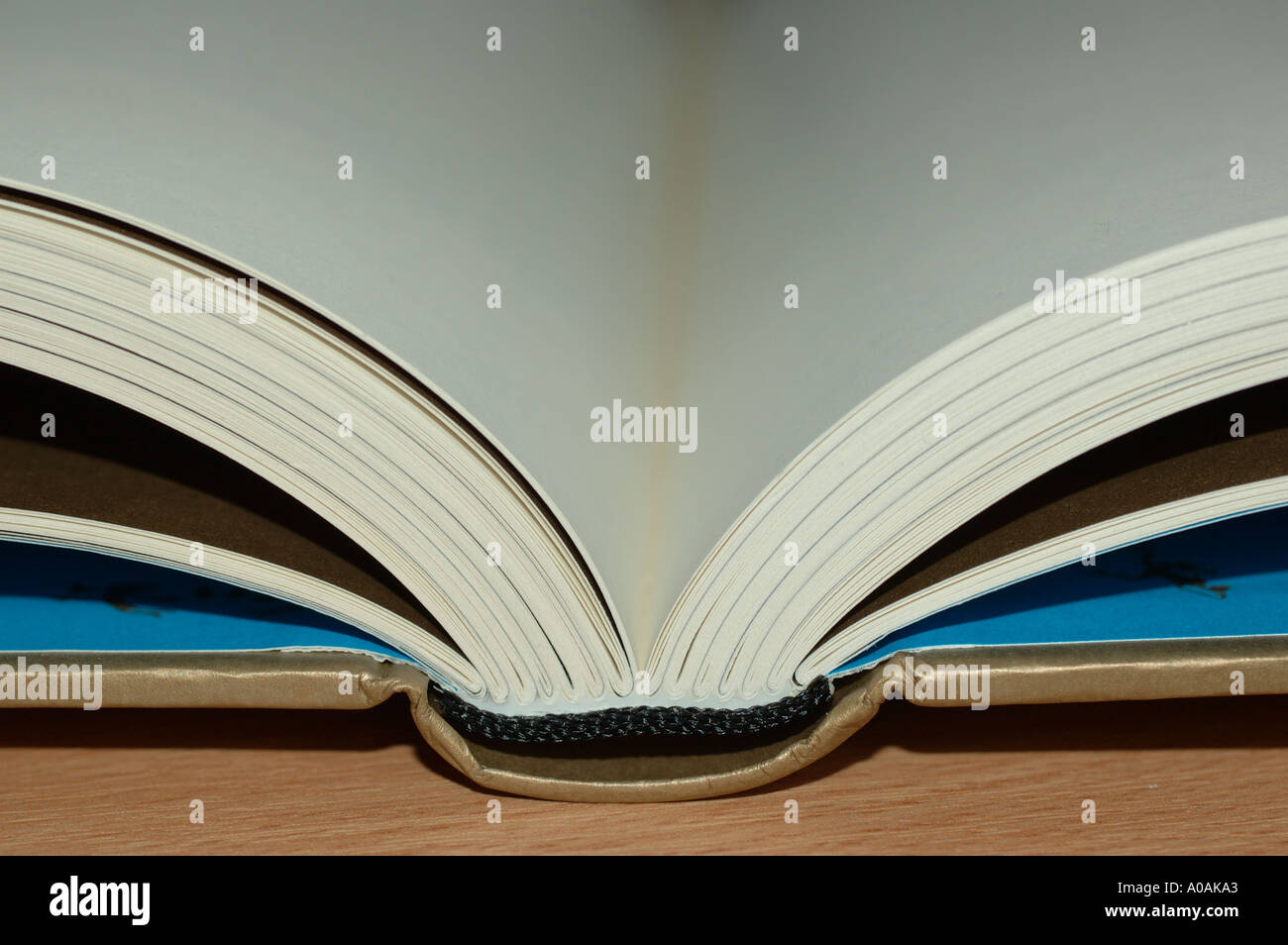 Close up of open book with golden cover Stock Photo - Alamy