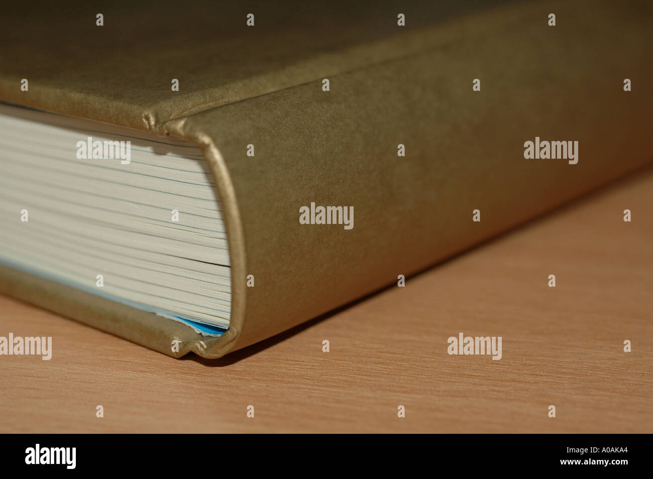 Golden cover of a book Stock Photo - Alamy