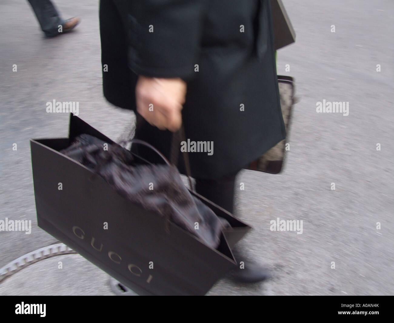 Woman with gucci shopping bag hi-res stock photography and images - Alamy