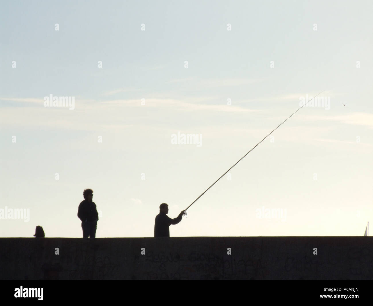 people fishing in sea Stock Photo - Alamy