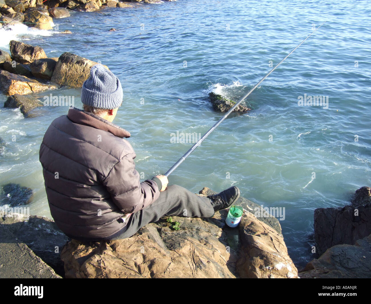 person fishing in sea Stock Photo - Alamy