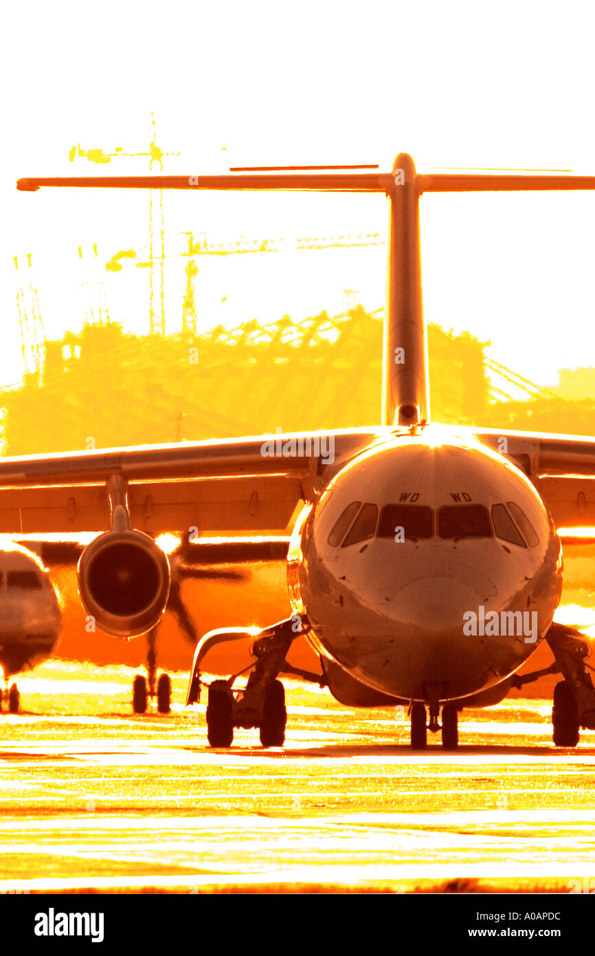 Commercial airplane in a queue for take off Stock Photo - Alamy