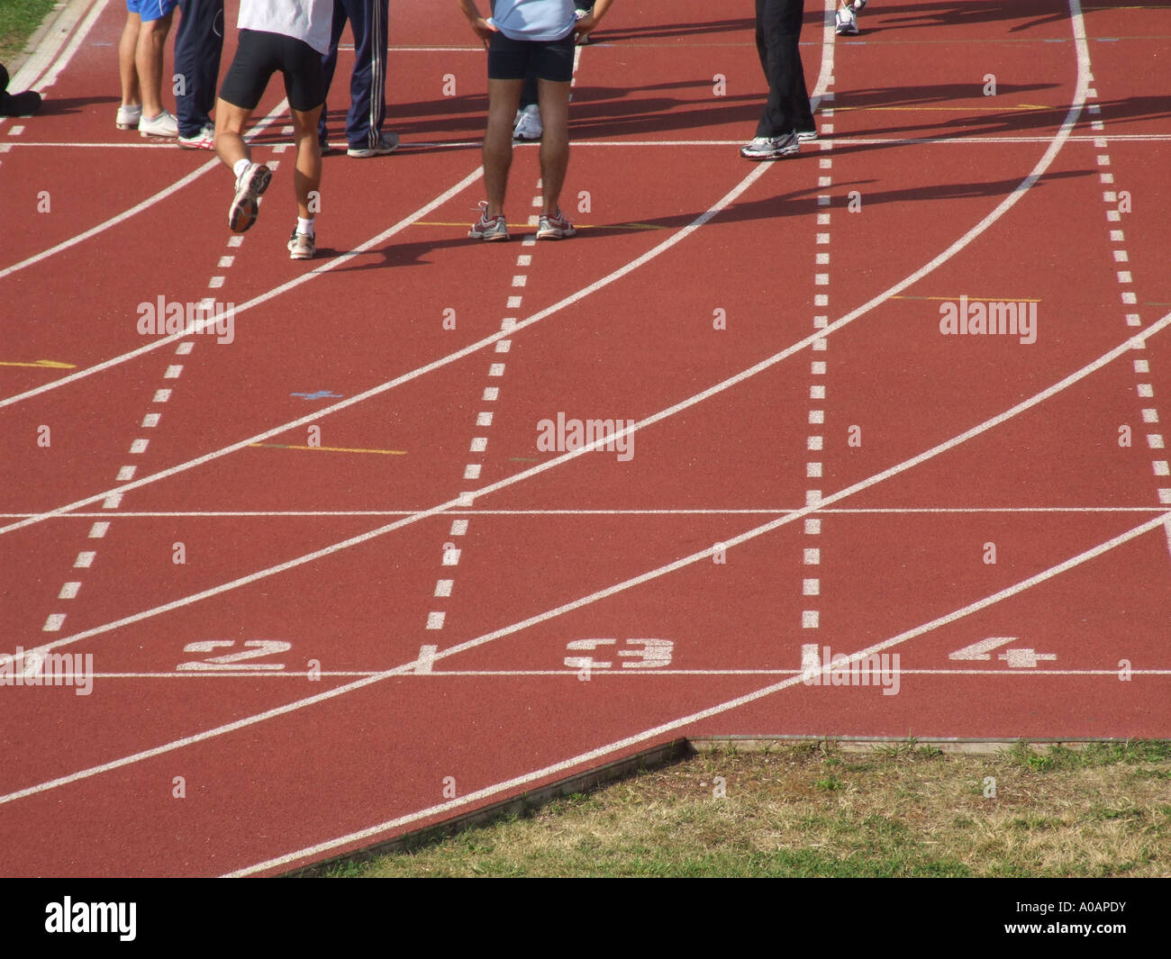 runners training on athletic track Stock Photo - Alamy