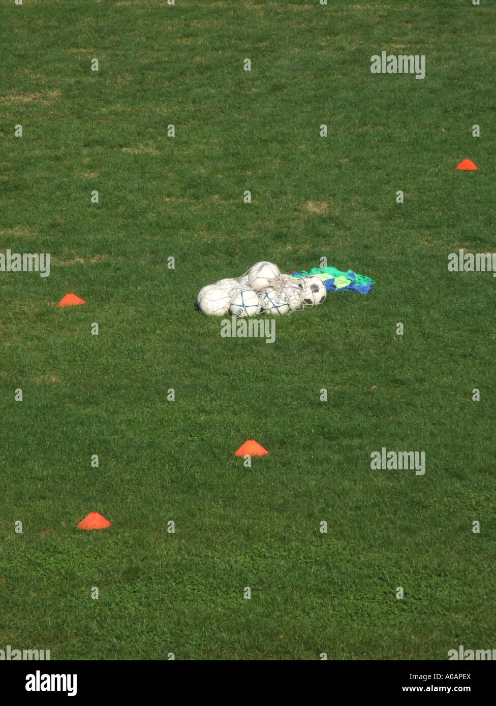 many footballs on training pitch Stock Photo - Alamy