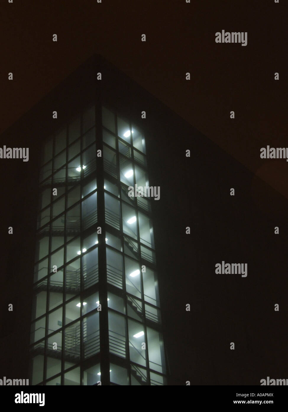 high rise building in fog at night Stock Photo - Alamy