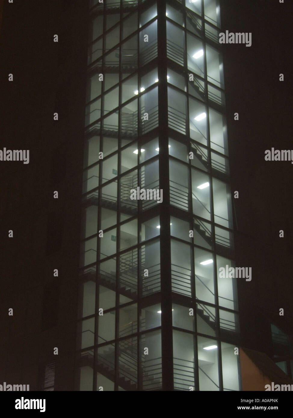 high rise building in fog at night Stock Photo - Alamy