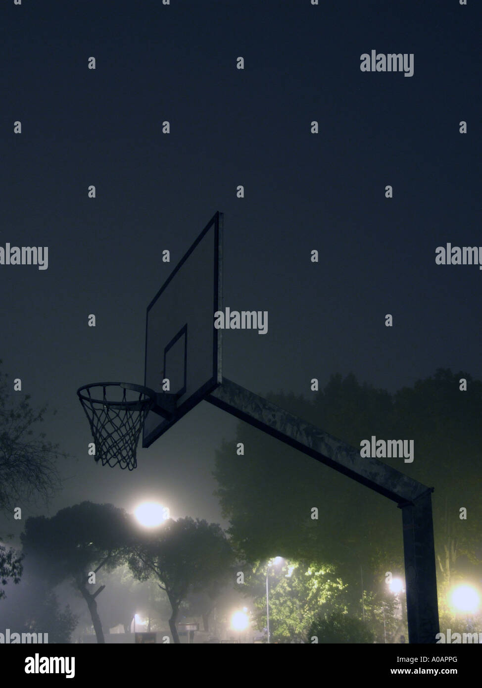 basketball court at night in thick fog Stock Photo - Alamy