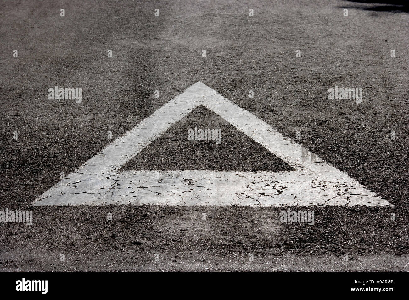 Give way yield sign on road Stock Photo - Alamy