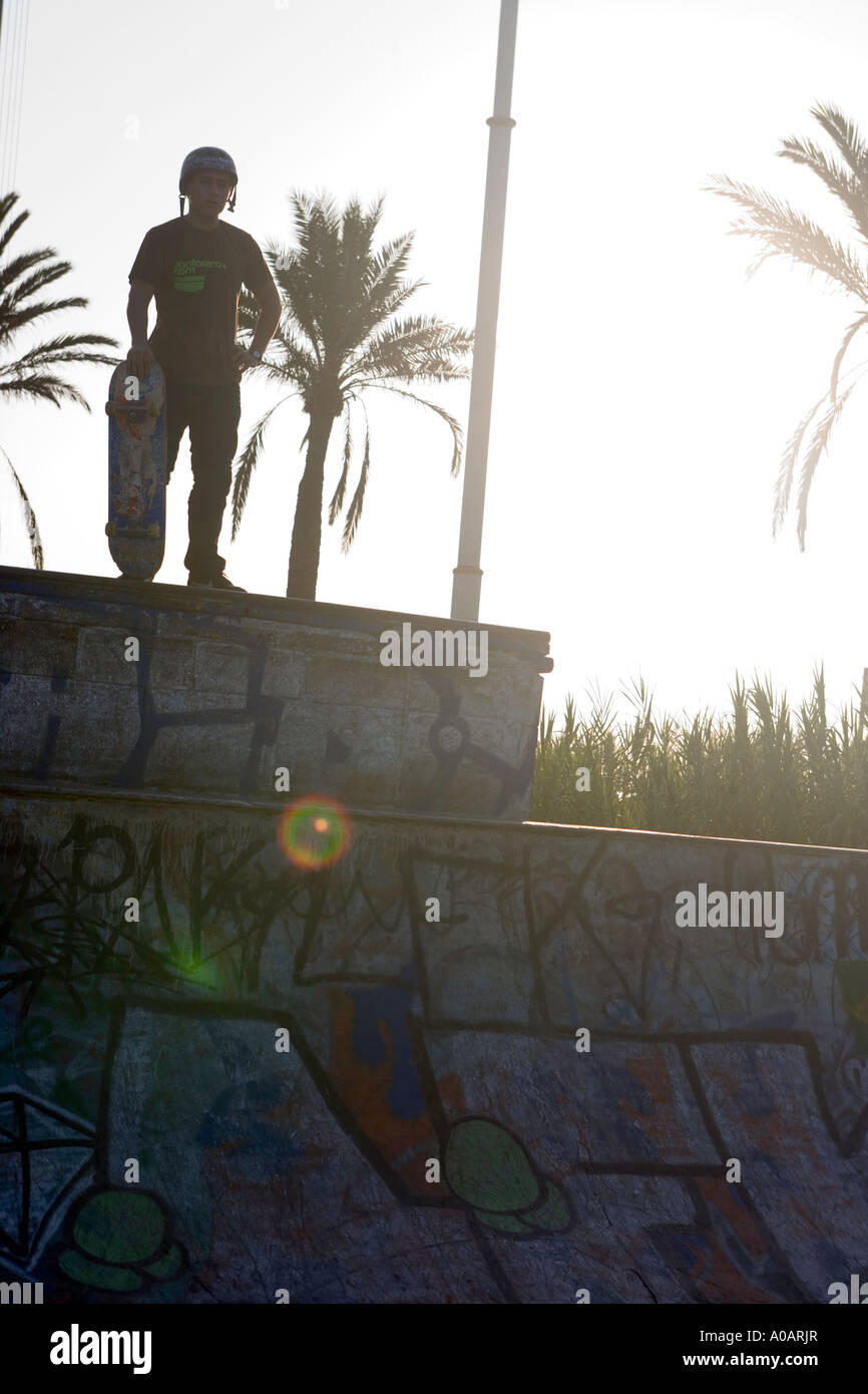 Skateboarder on edge of ramp Stock Photo - Alamy