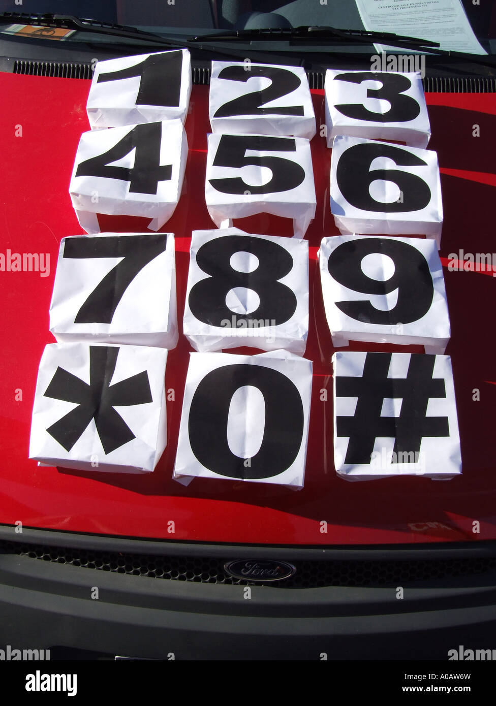 paper sculpture push button phone numbers Stock Photo - Alamy