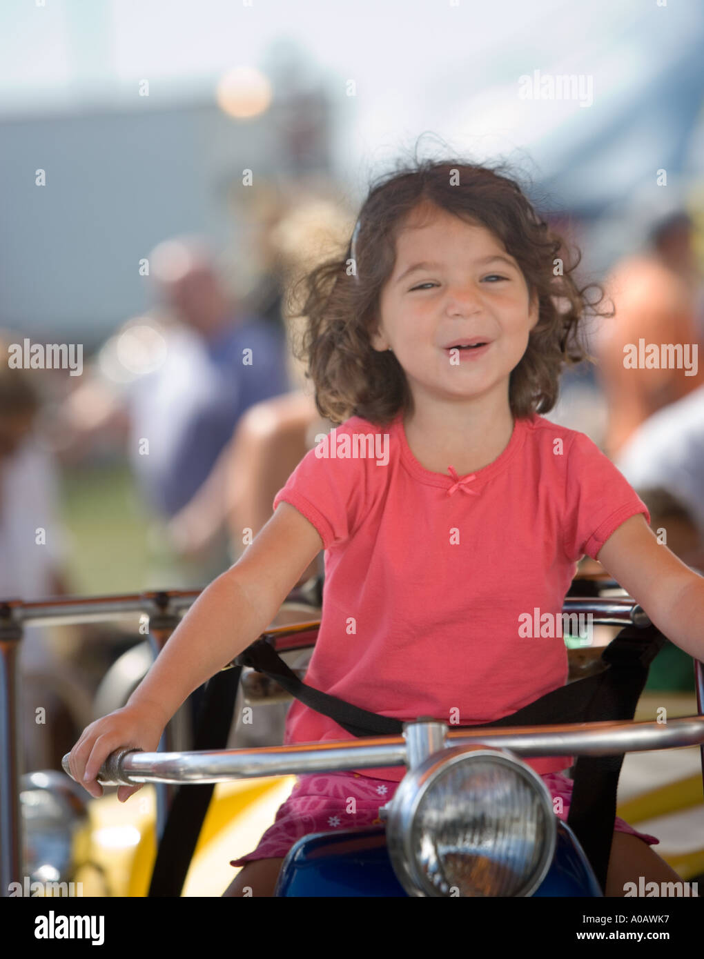 Portrait Caucasian girl on amusement ride at county fair Stock Photo ...