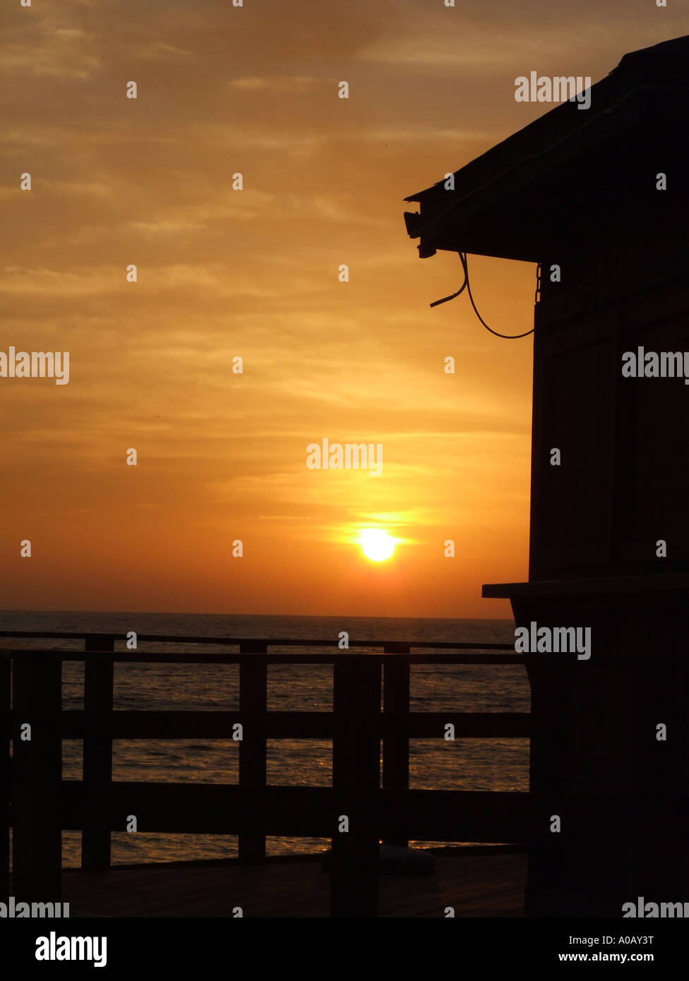one beach hut and sunset Stock Photo - Alamy
