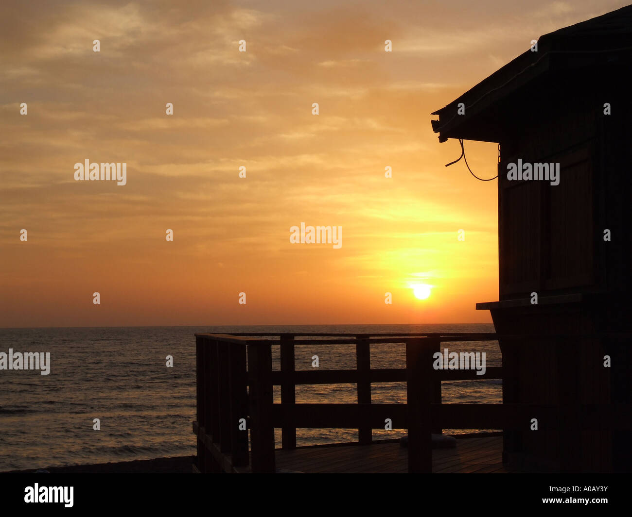 one beach hut and sunset Stock Photo - Alamy