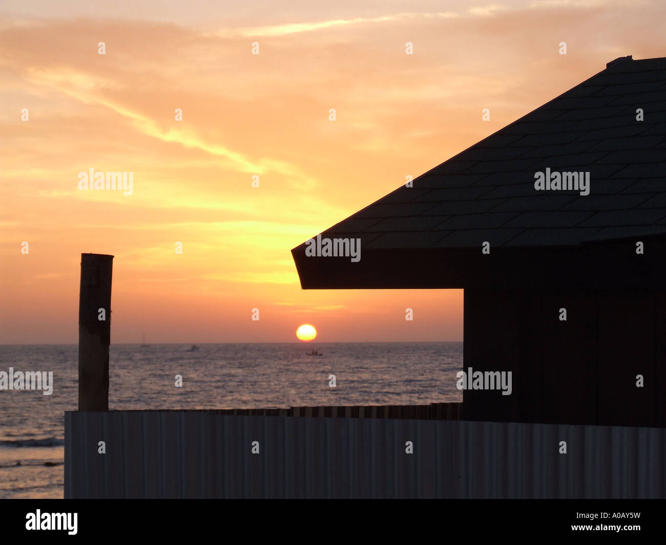 one beach hut and sunset Stock Photo - Alamy