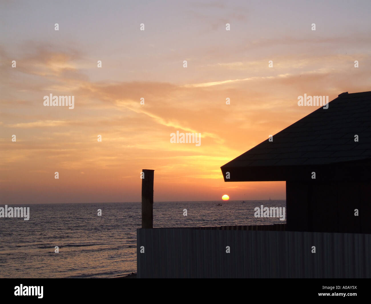 one beach hut and sunset Stock Photo - Alamy