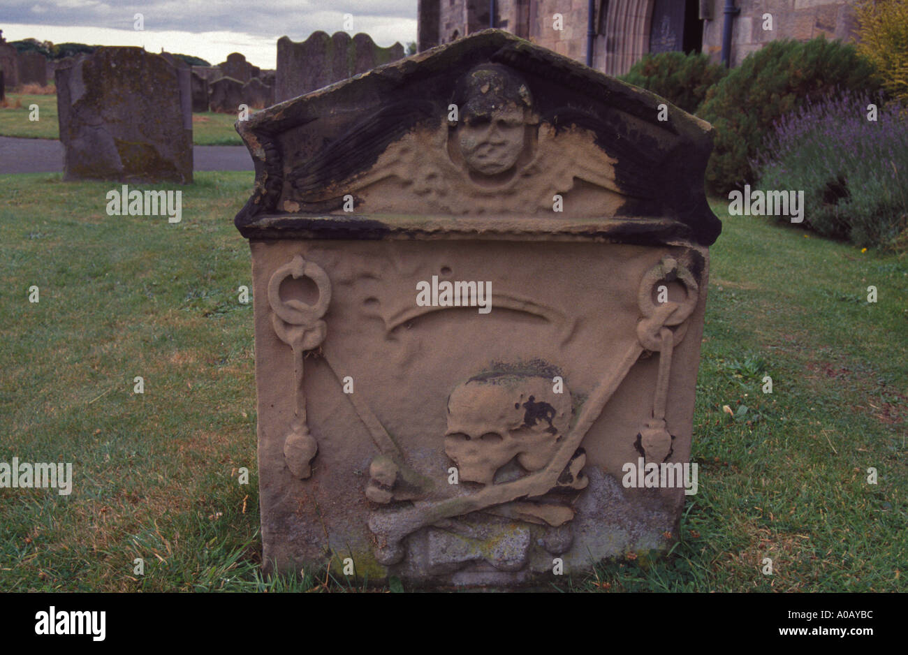 Eroded old gravestone in Bamburgh Northumberland England Stock Photo ...