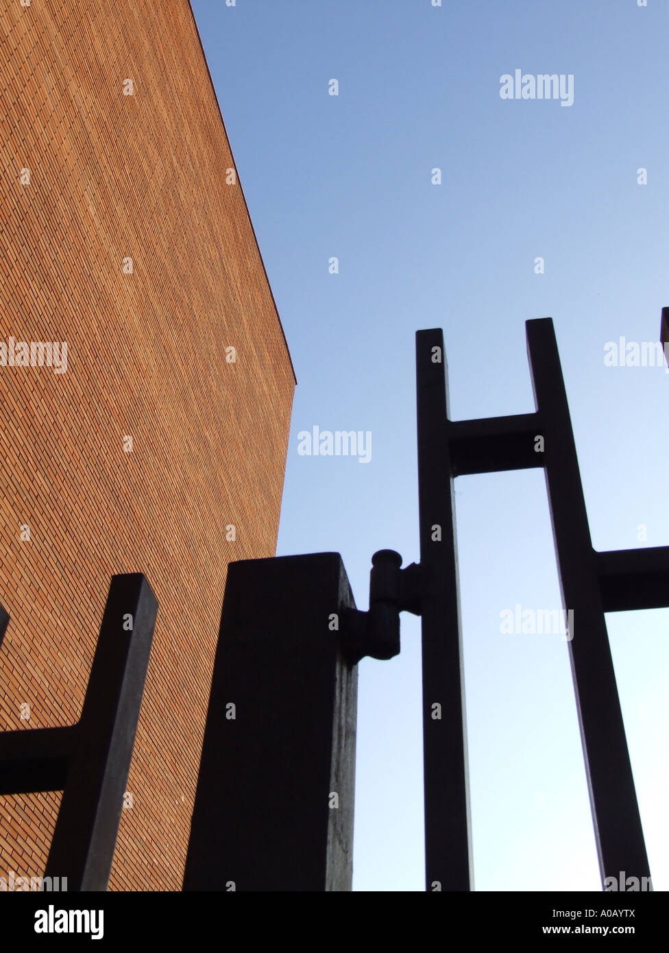 Black iron gate with red brick building hi-res stock photography and ...