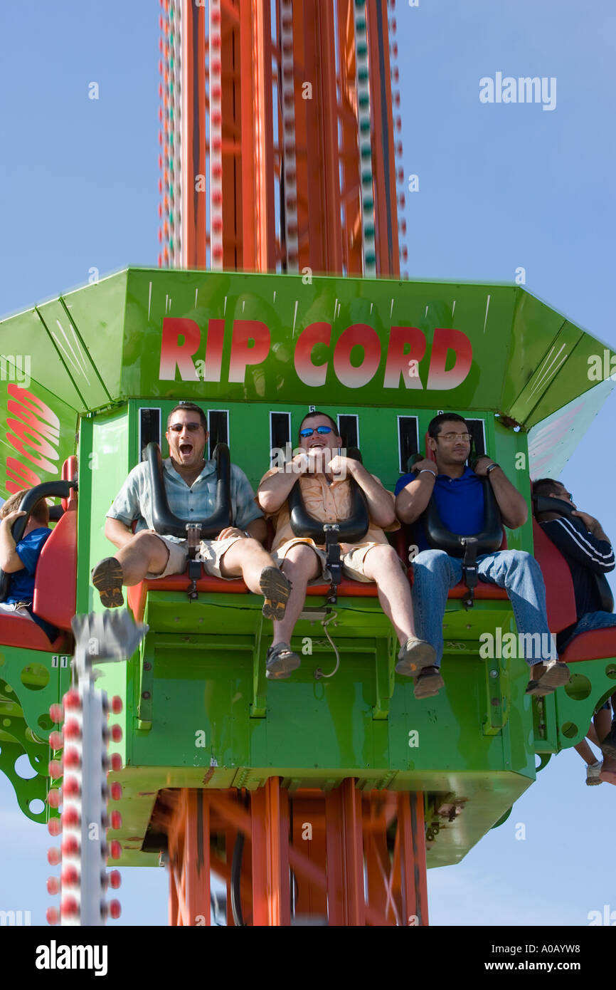 Carnival Ride drops down Stock Photo - Alamy