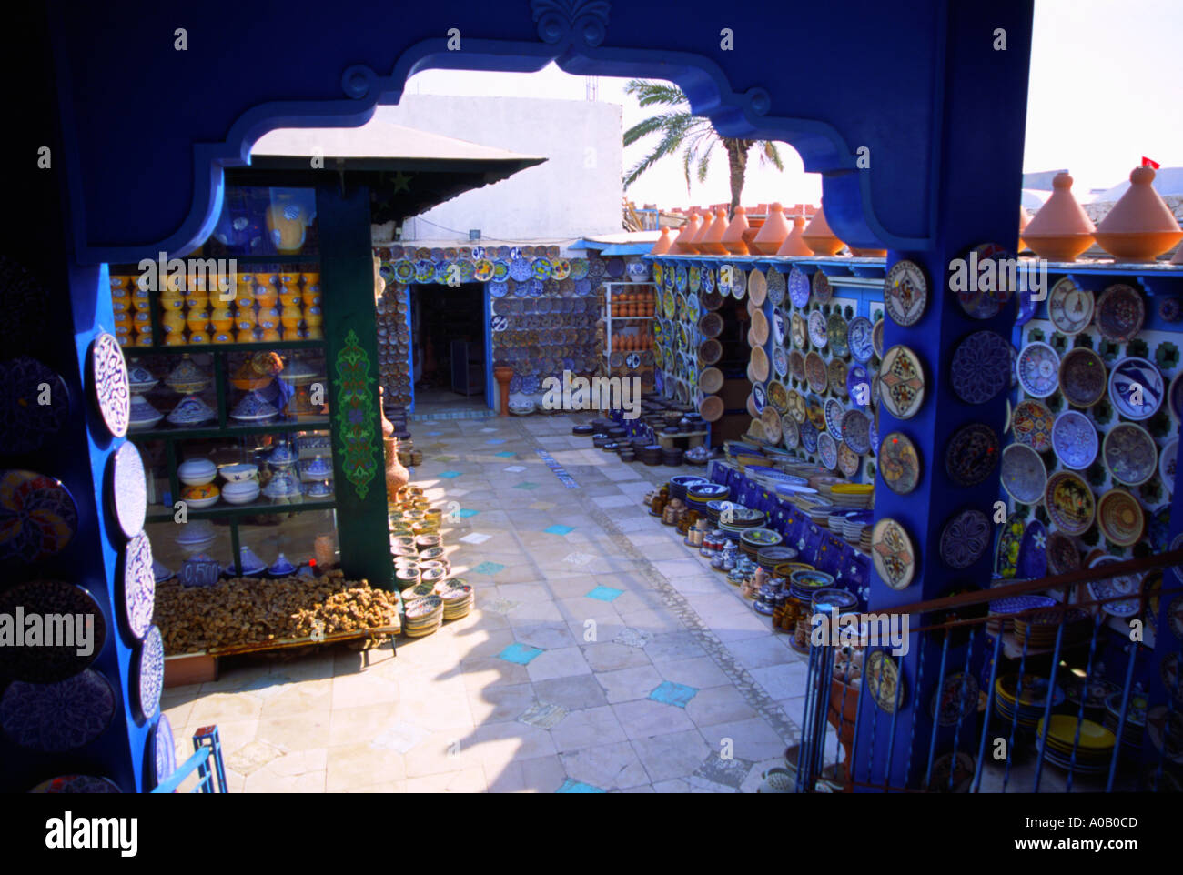 Outside store display pottery Tunisia 112 Stock Photo - Alamy