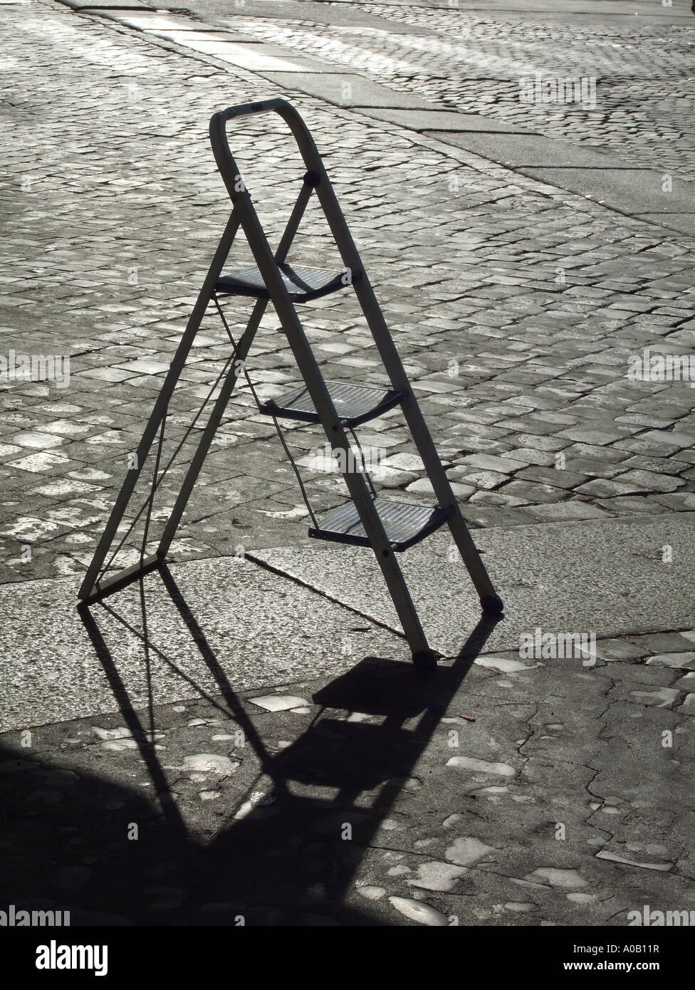 detail of step ladder in empty street road Stock Photo - Alamy