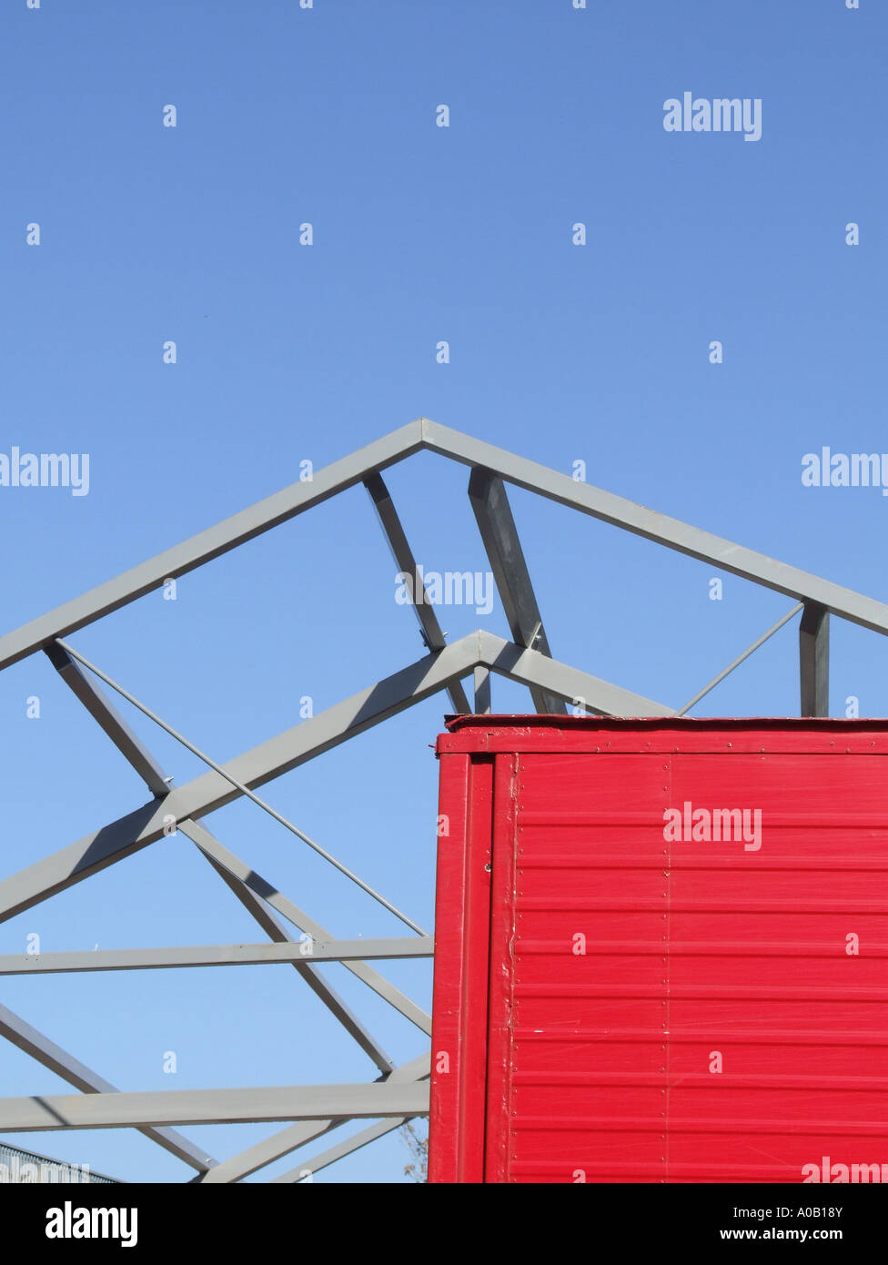 building under construction and blue sky with red lorry Stock Photo - Alamy