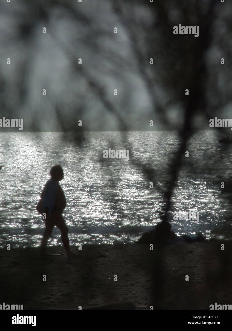 person on beach Stock Photo - Alamy