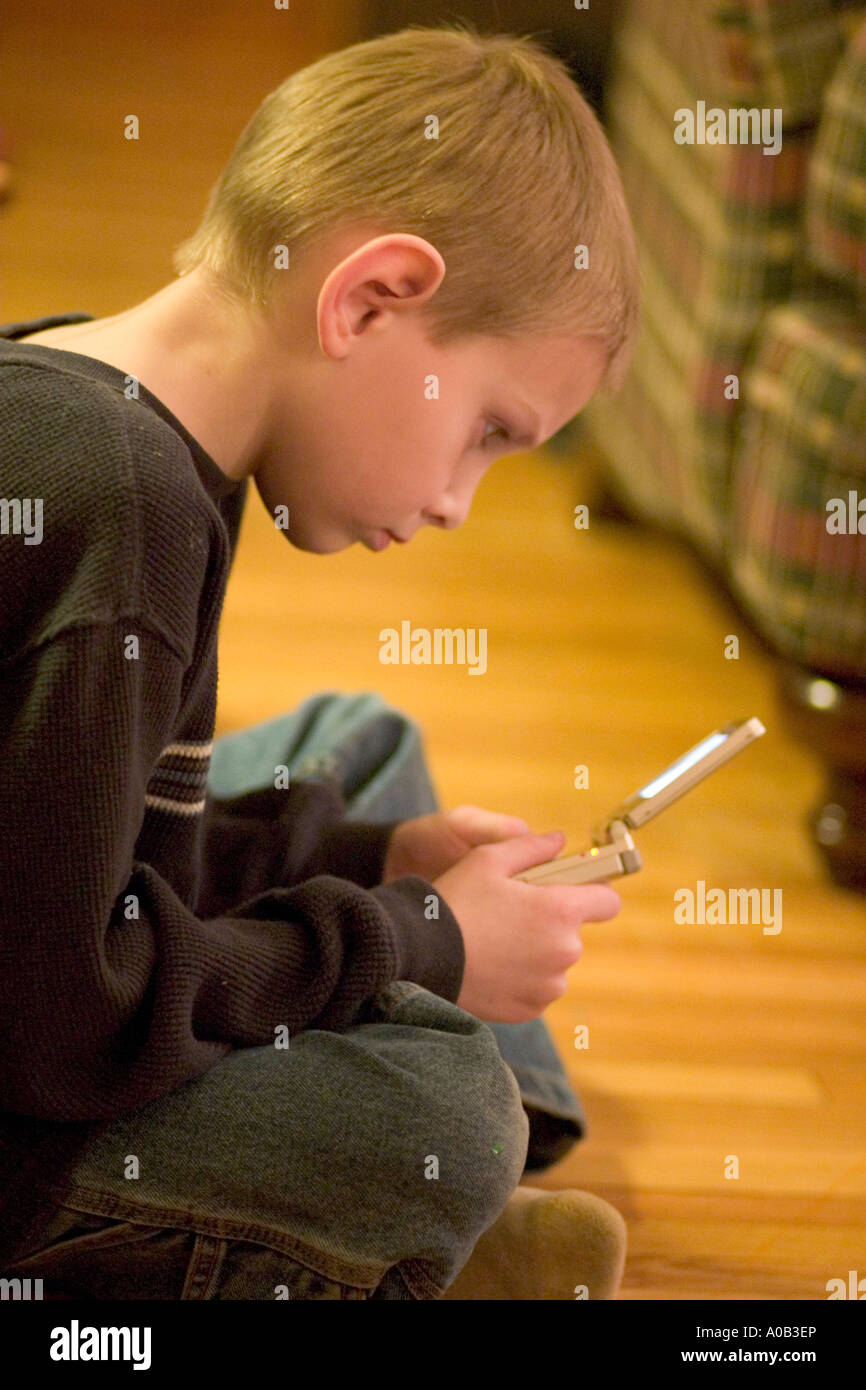 Kids intensely playing video game hi-res stock photography and images ...