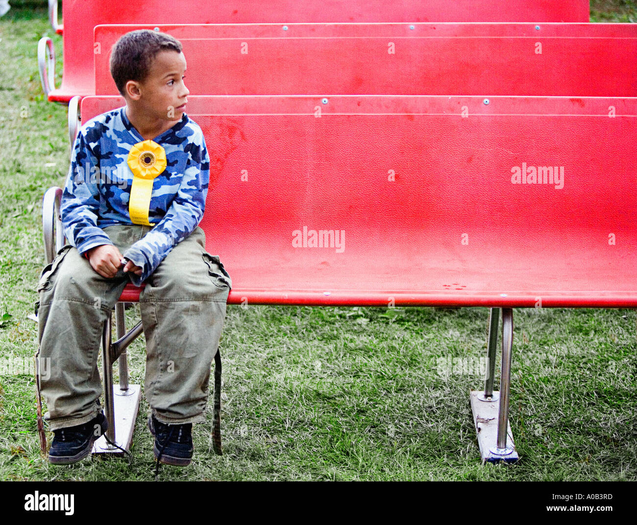 African American boy sitting alone Stock Photo - Alamy