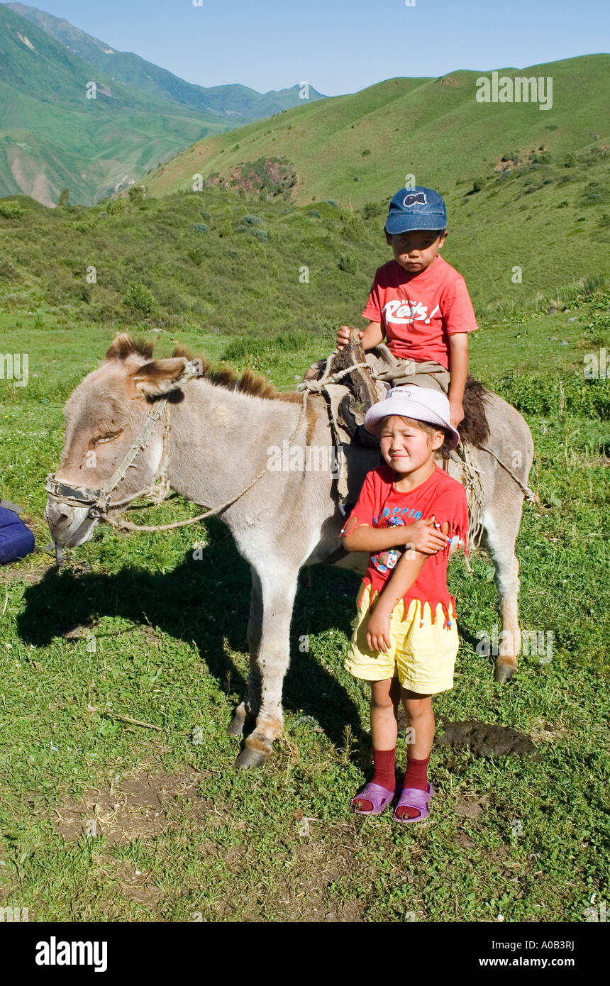 kirgis boy sitting on a donkey Kyrgyzstan Kyrgyz Republic Stock Photo ...
