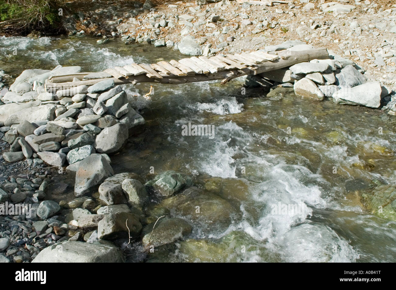 primitive bridge over a mountain stream at Hemis National Park Ladakh ...