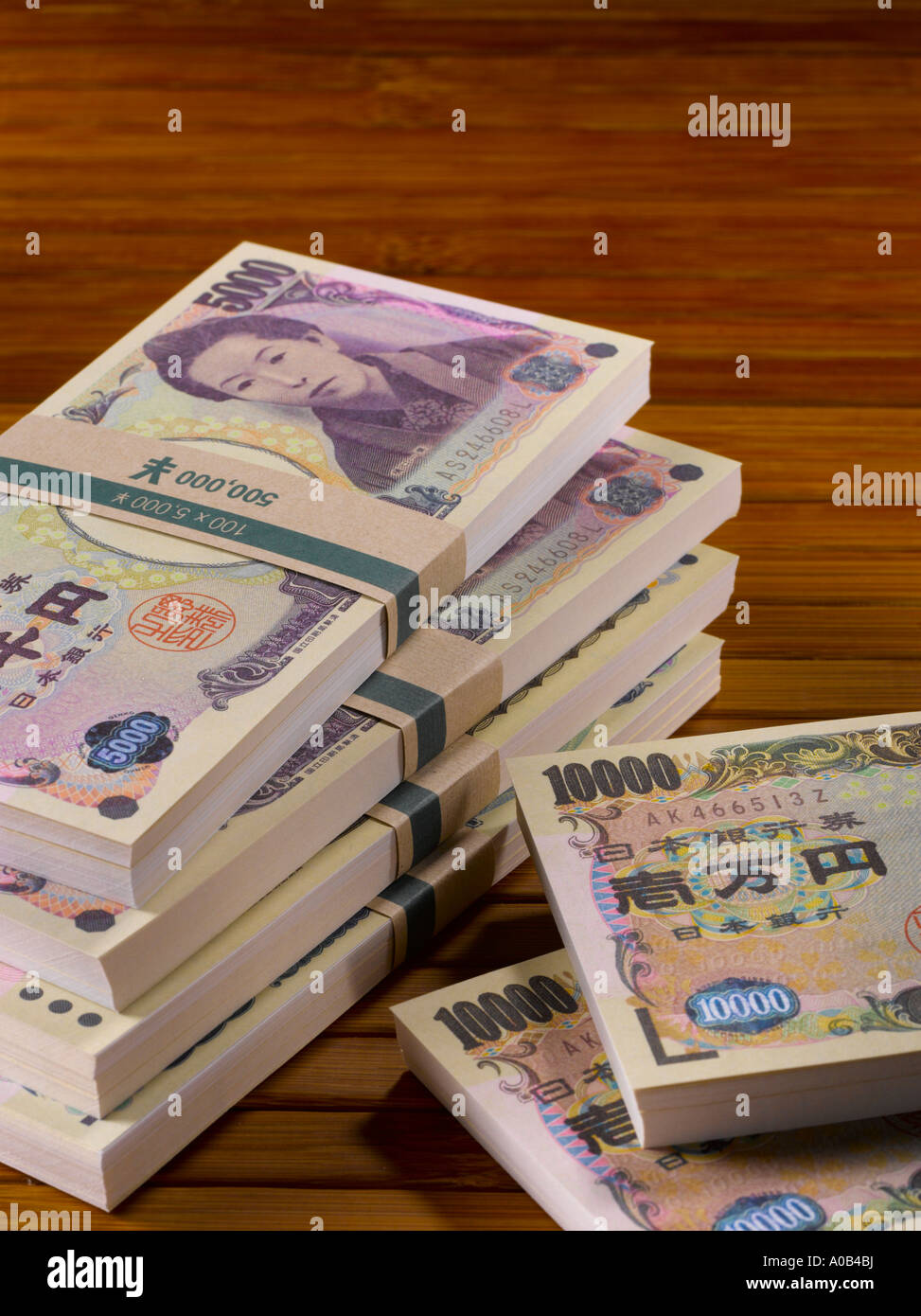 Two stacks of Japanese Yen Stock Photo - Alamy