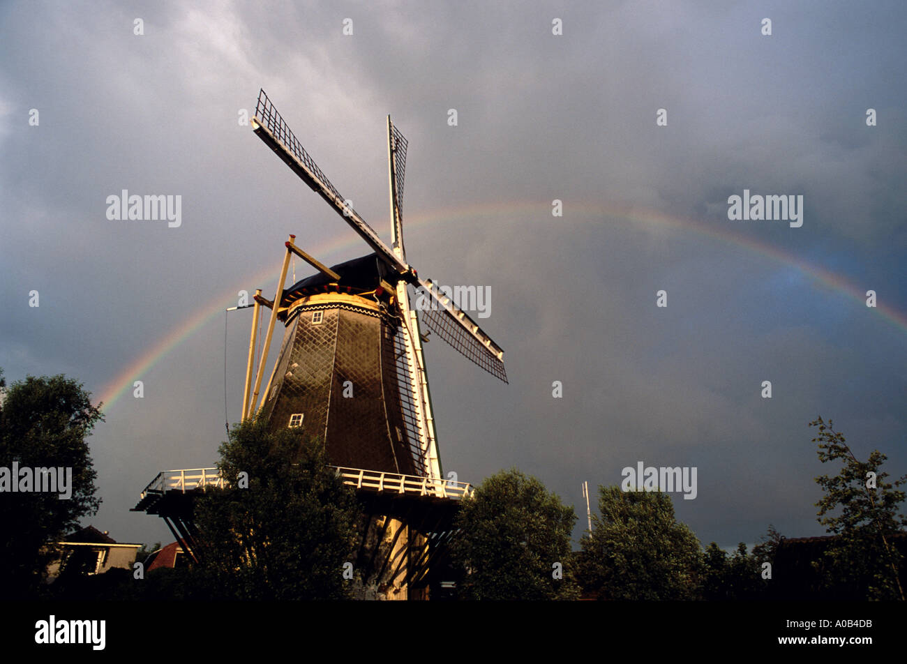 Windmill with rainbow Stock Photo - Alamy