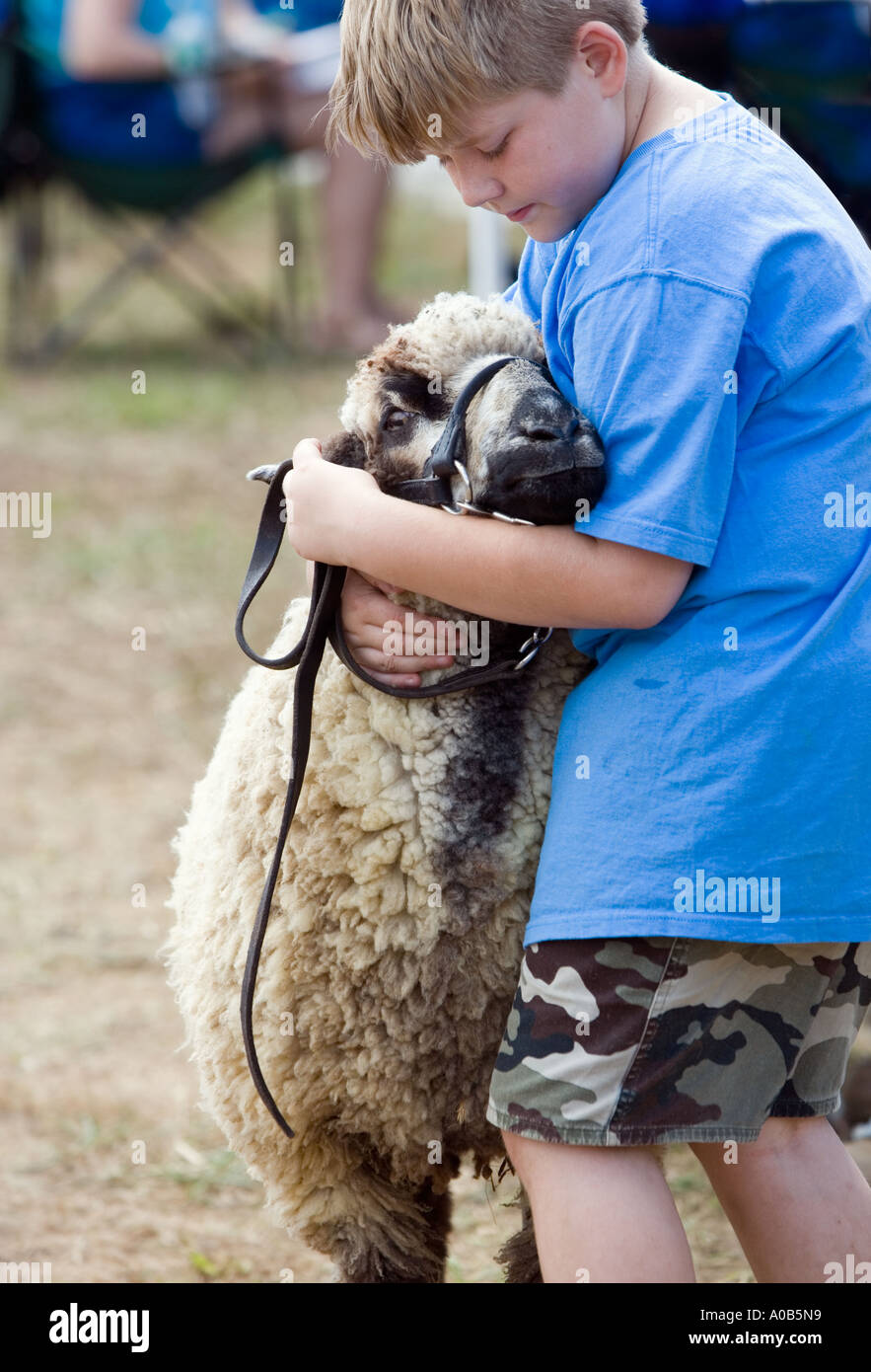 Boy showing animal at county fair hi-res stock photography and images ...