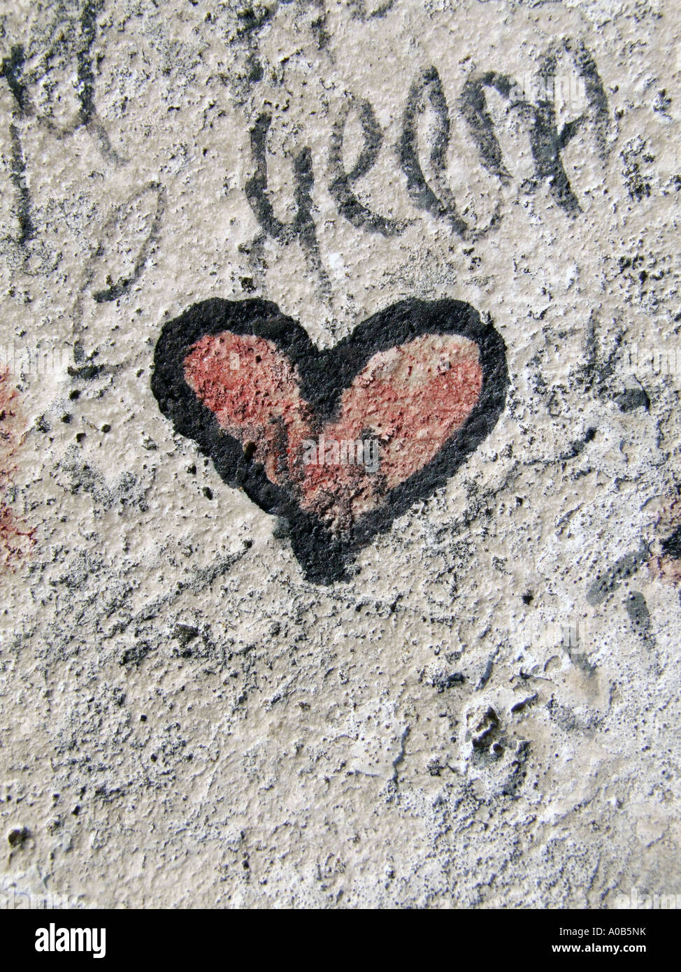 one single red heart painted on wall Stock Photo - Alamy