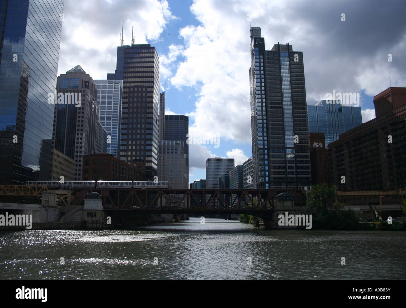 Chicago subway train crossing bridge over Chicago river with Willis ...