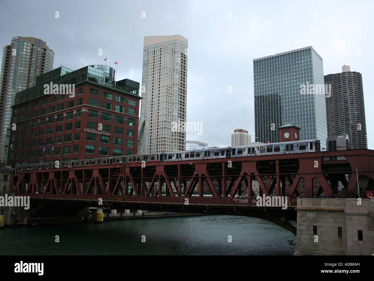 Chicago subway train crossing bridge over chicago river with marina ...