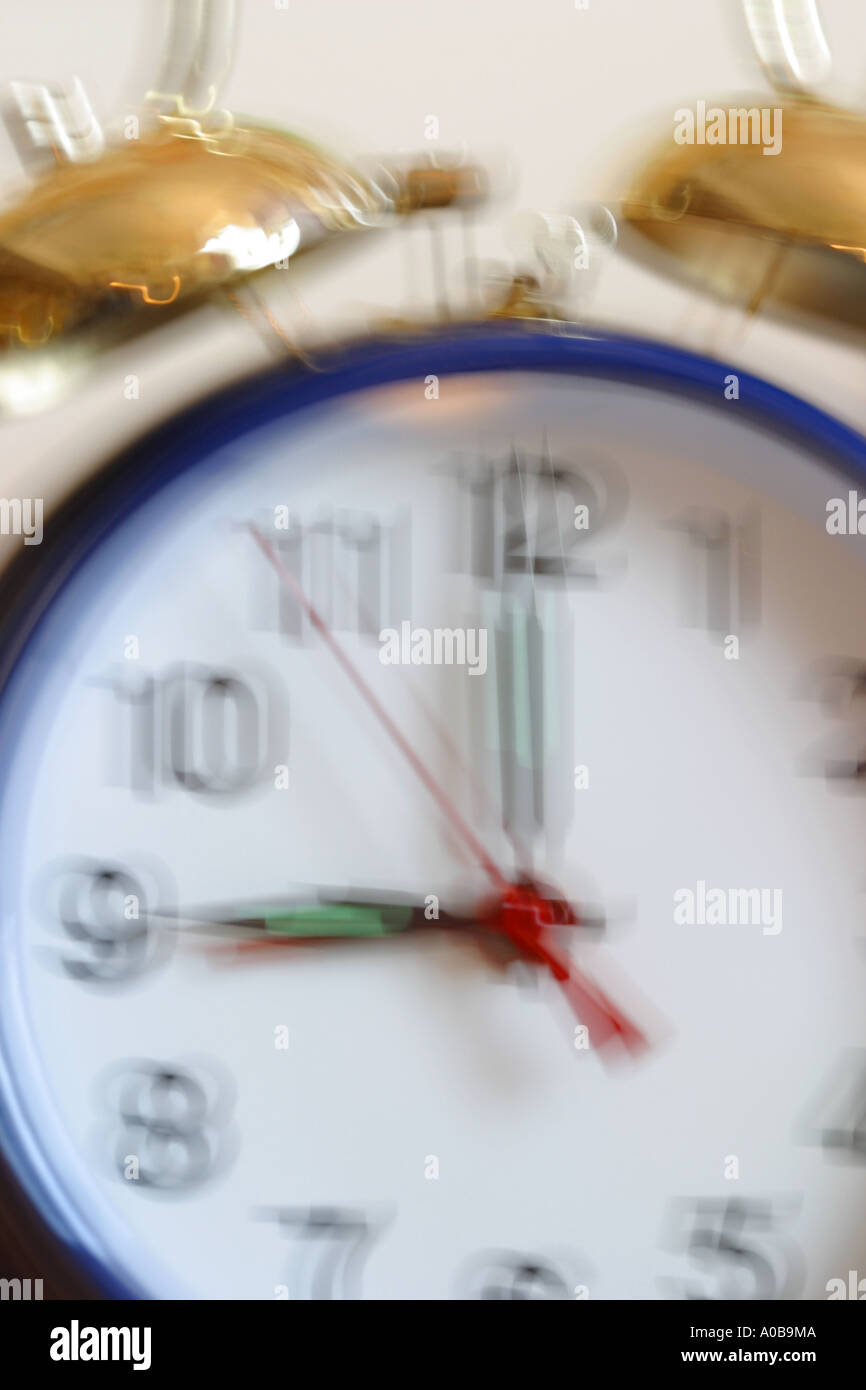 Alarm clock ringing blur Stock Photo - Alamy